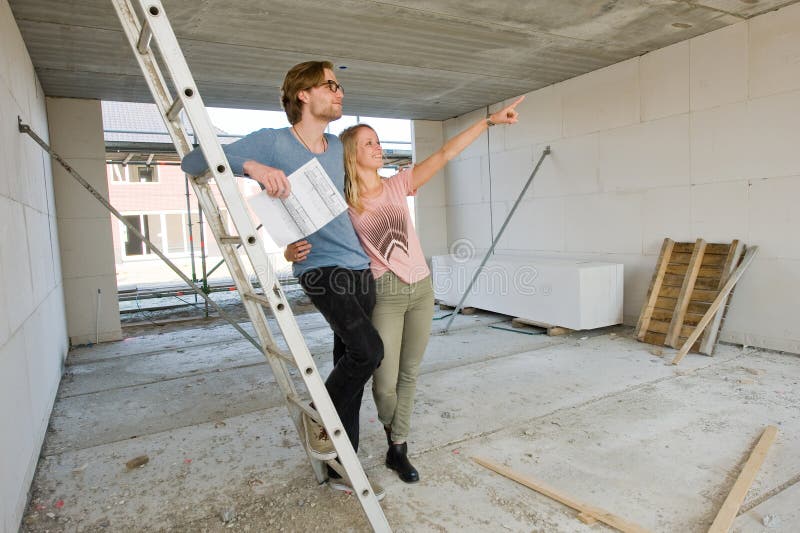 Young Couple on Construction Site Stock Image - Image of estate ...