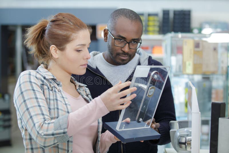 Young Couple in Consumer Electronics Store Stock Image - Image of help ...