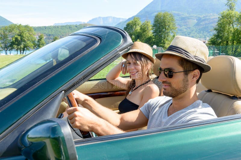 A Young Couple in a Convertible Car Stock Photo - Image of trip, young ...