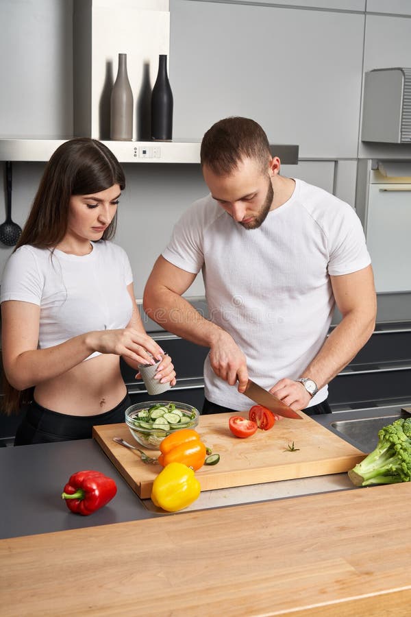 Young Couple Coocking Salad in the Kitchen Stock Image - Image of home ...