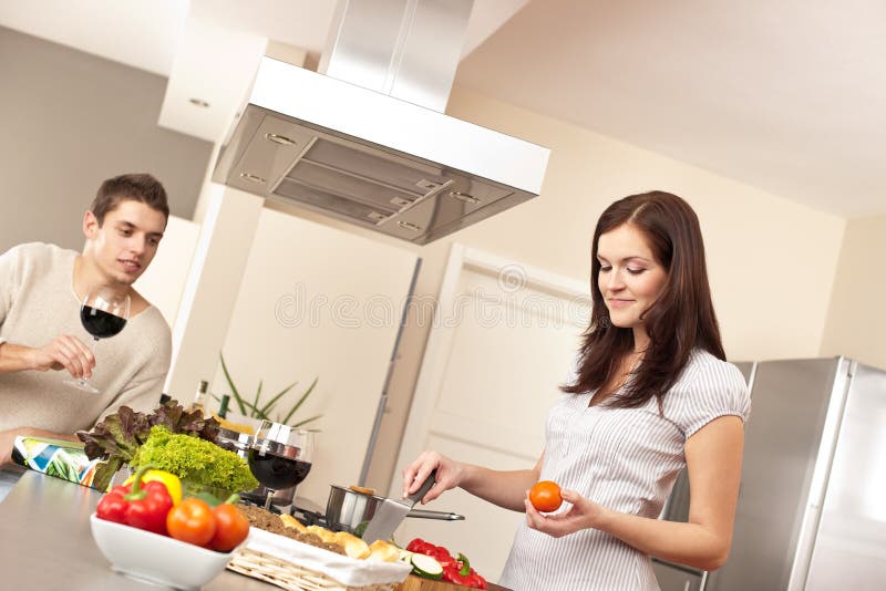 Young Couple Cooking in Kitchen Together Stock Photo - Image of woman ...