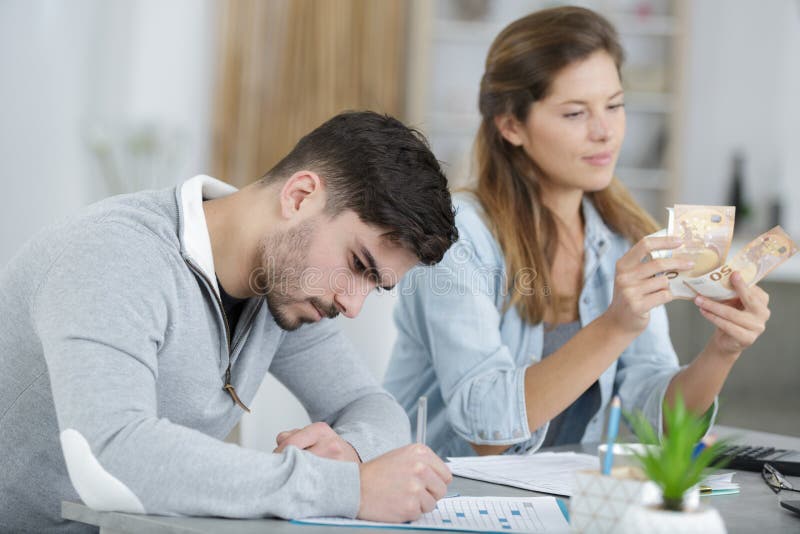 Young Couple Counting Money Stock Photo - Image of moving, money: 264392574
