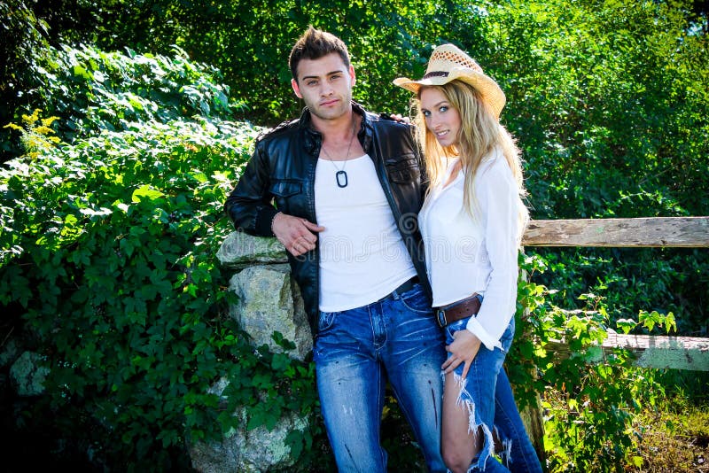 Young Couple in a Country Setting. Stock Image - Image of wall, model ...
