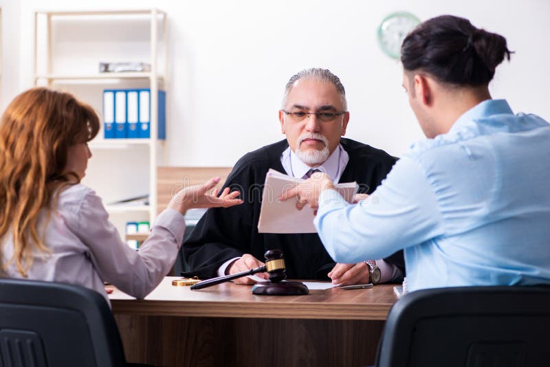 The Young Couple in the Courthouse in Divorce Concept Stock Photo ...