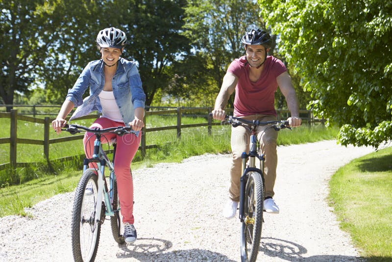 Young Couple on Cycle Ride in Countryside Stock Image - Image of ...