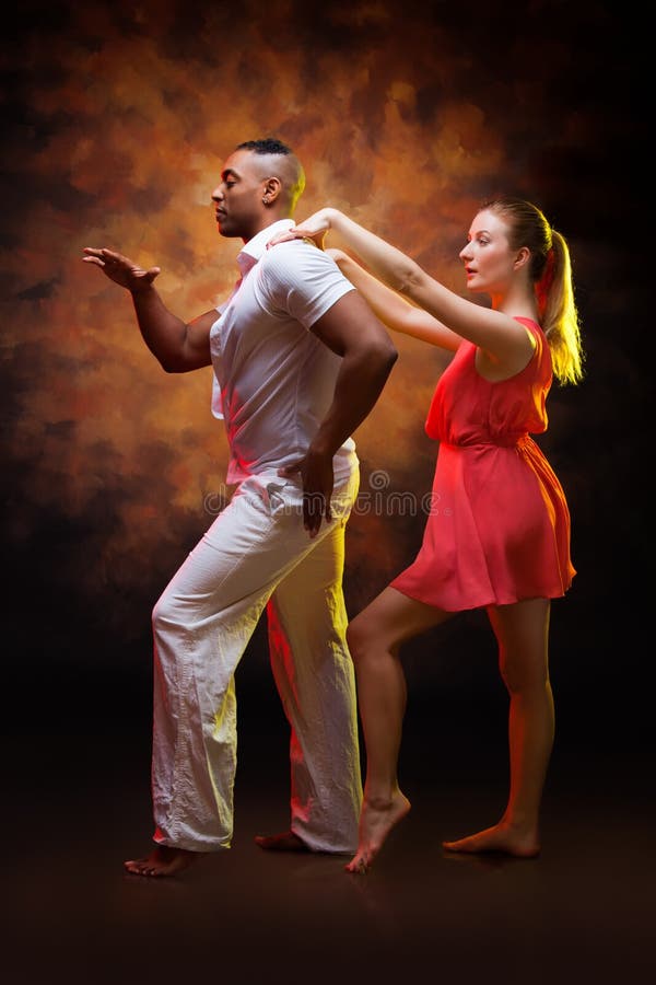 Salsa Dancer Spinning His Female Partner Stock Photo - Image of latin ...
