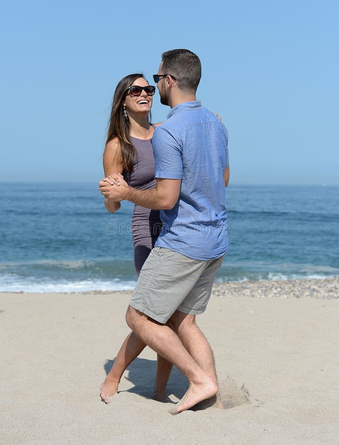 Young Couple Dancing on Beach Stock Image - Image of beach, caucasian ...