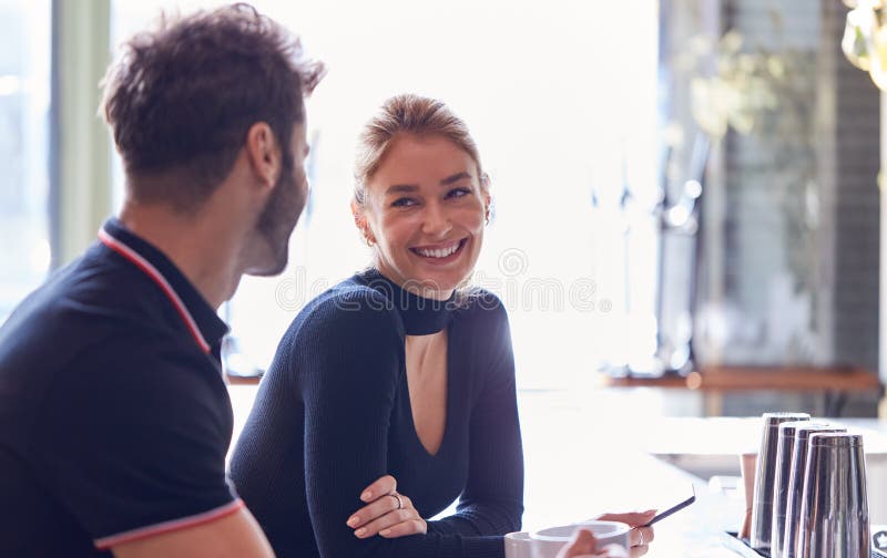 Young Couple on Date Sitting at Coffee Shop Table Together Stock Image ...