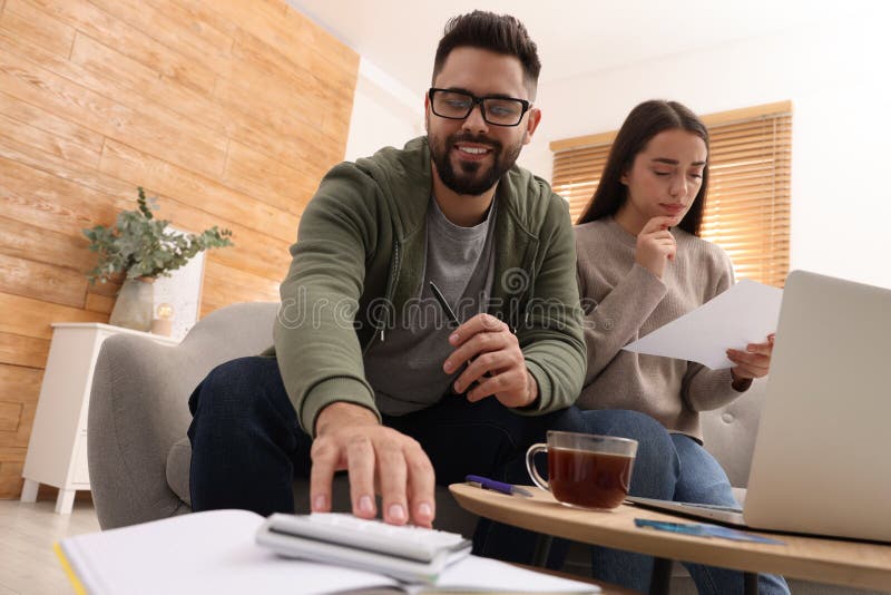 Young Couple Discussing Family Budget at Home Stock Image - Image of ... Young Couple Discussing Family Budget at Home Stock Image - Image of ...