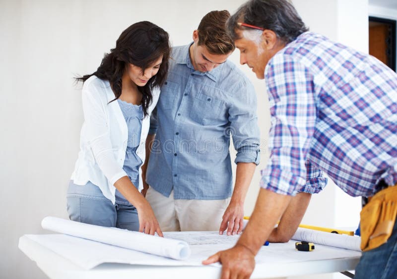 Young Couple Discussing House Plan with Architect. Young Couple ...