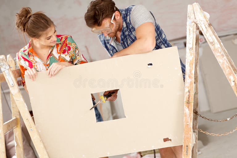 Young couple DIY stock image. Image of improving, clothing - 29117177
