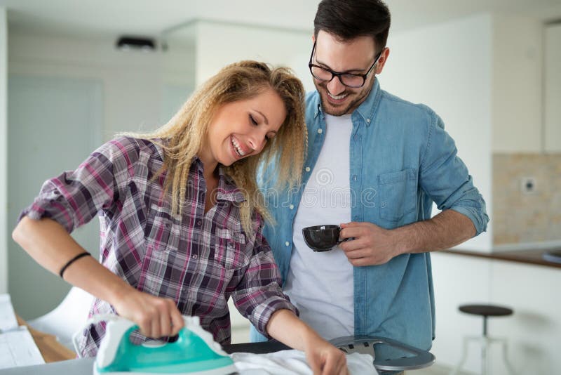 Young Happy Couple Doing the Ironing Together Stock Photo - Image of ...
