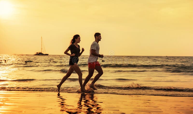 Young Couple Doing Jogging on the Tropical Beach Stock Photo - Image of ...