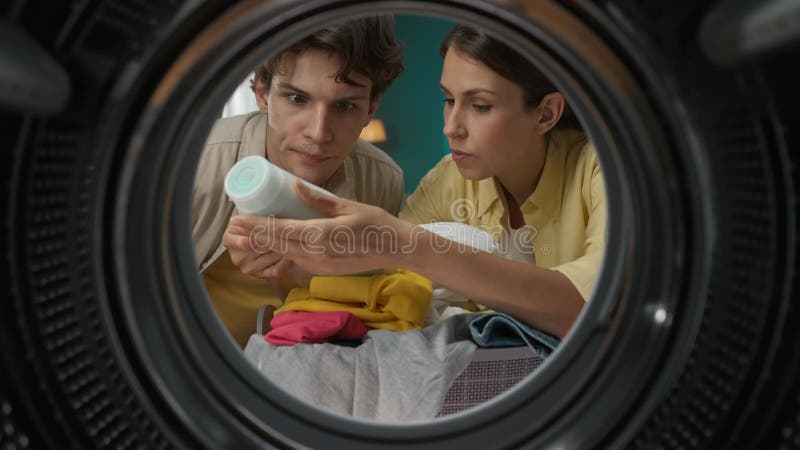 View From Inside The Empty Washing Machine Woman Teaches Her Man How To Use The Washer Hdr