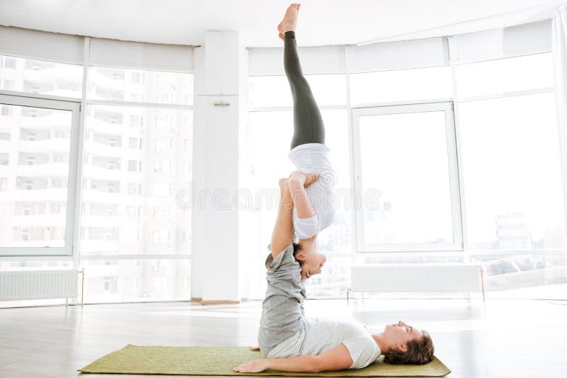 Young Couple Doing Relaxation Exercises Together Stock Image - Image of ...