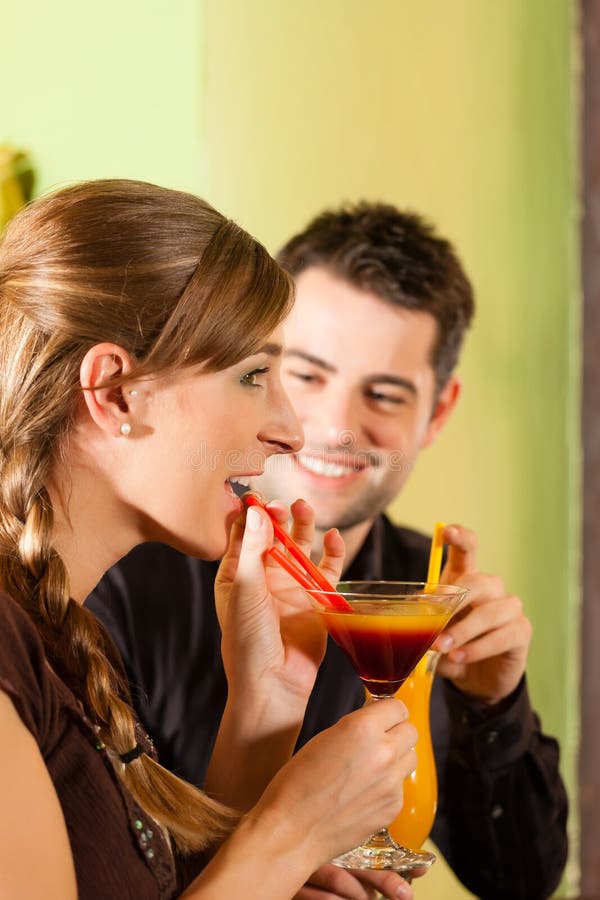 Young Couple Drinking Cocktails in Stock Photo - Image of happiness ...