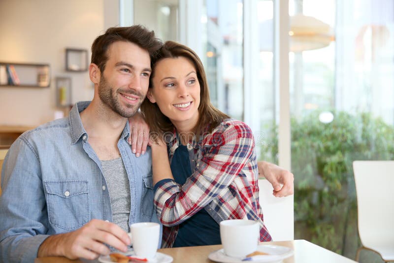 Young Couple Drinking Coffee at the Coffee Shop Stock Image - Image of ...