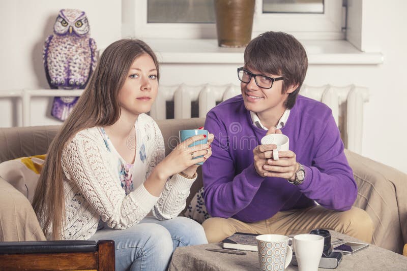 Young Couple Drinking Tea in the Discussion of Ideas Stock Image ...