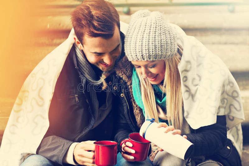 Young Couple Drinking Tea Outdoors Stock Image - Image of sitting ...