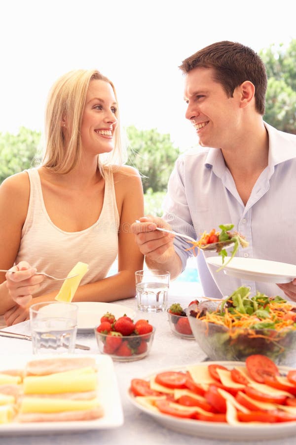 Young Couple Eating Outdoors Stock Image - Image of salad, enjoying ...