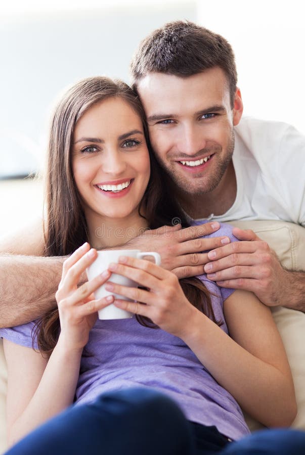 Young couple embracing stock photo. Image of interior - 30551904