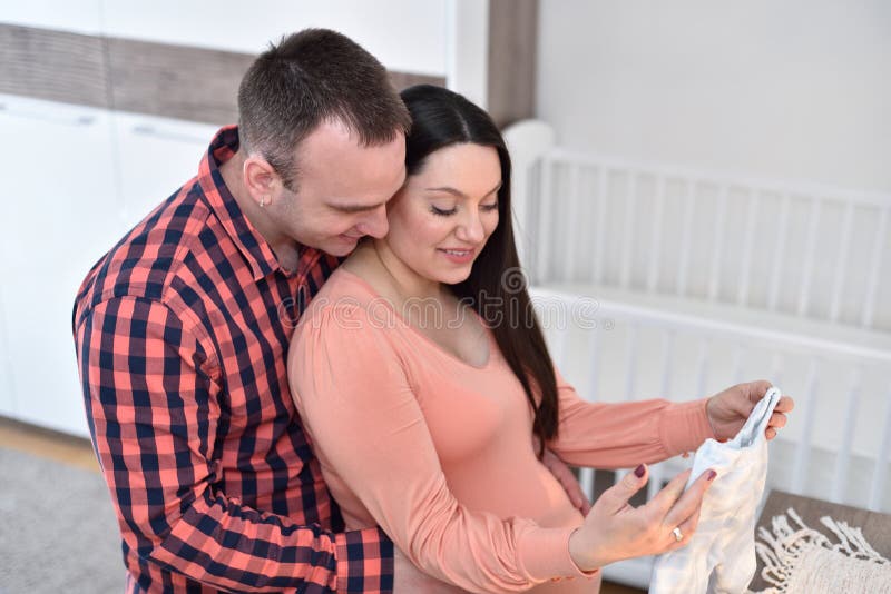 Young Couple Expecting a Baby Stock Image - Image of clothes, belly ...