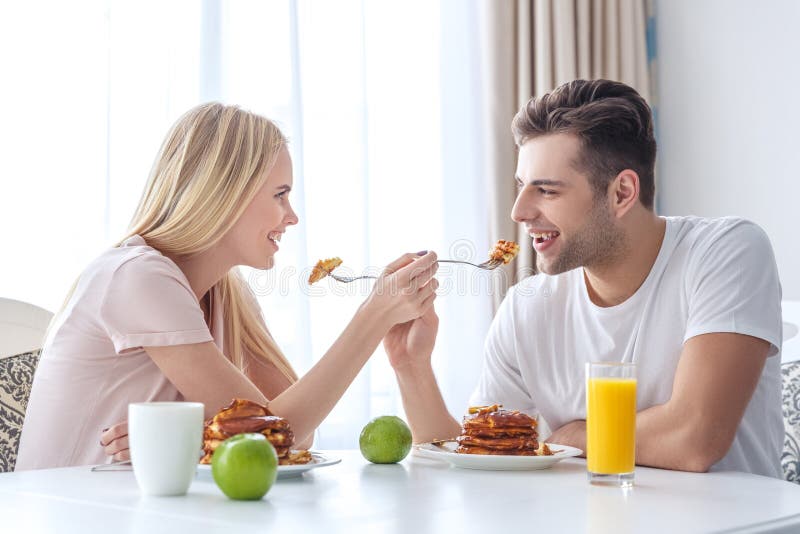 Young Couple Feeding Each Other Stock Photo - Image of loving ...