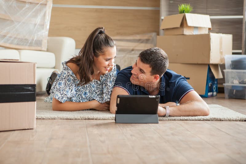 Young Couple Feeling Amused in Their New House Stock Photo - Image of ...