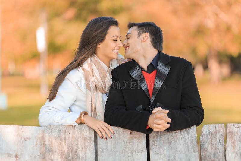 Young couple by the fence stock image. Image of bonding - 34632983