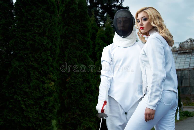 Young Couple in Fencing Costumes Stock Image - Image of outdoors ...