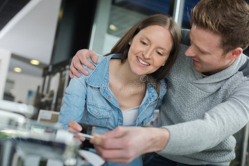Young Couple Fixing Devise at Home Stock Photo - Image of tech, detail ...