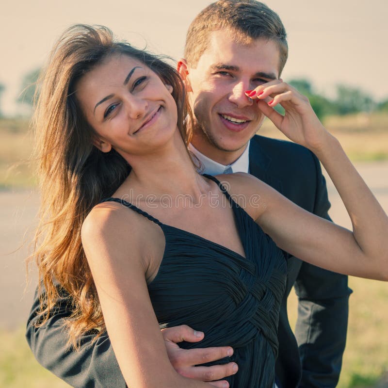 Young Couple Flirting Outdoors Stock Image - Image of adult, looking ...