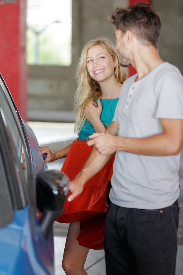 Young Couple Getting in Car Smiling To Each Other Stock Photo - Image ...