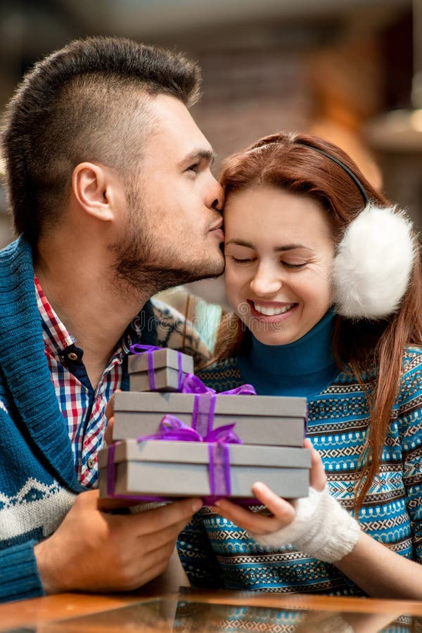 Young Couple with Gift Boxes at the Cafe in Winter Stock Image - Image ...