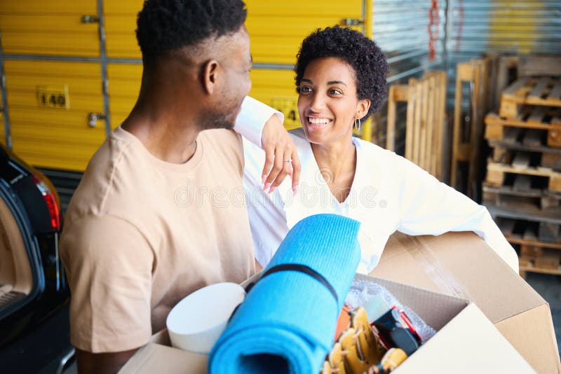 Young Couple Has Brought Things for Storage Stock Photo - Image of ...