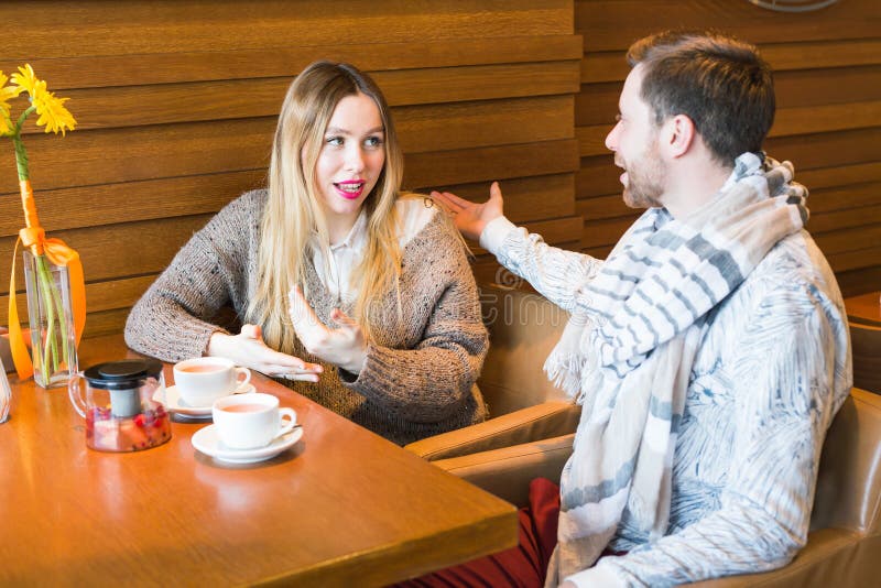 Young Couple Have Interesting Discussion in Cafe Stock Image - Image of ...