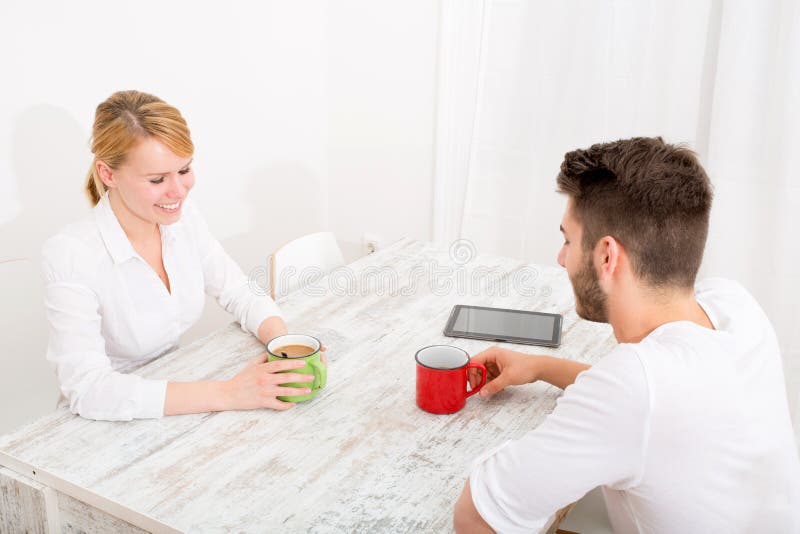 Young Couple Having a Coffee Break Stock Photo - Image of living ...