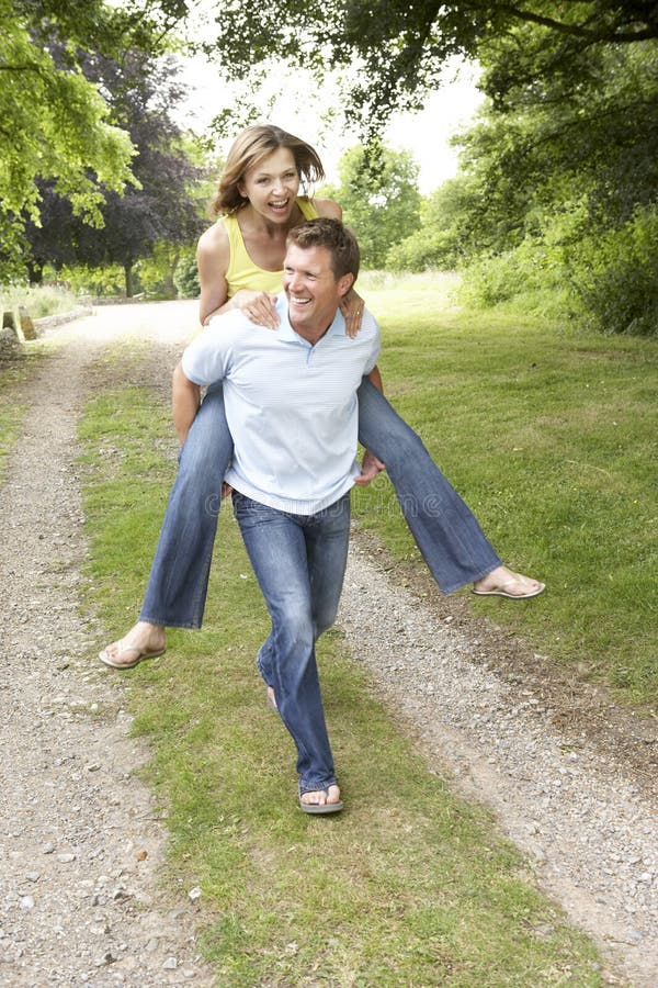Young Couple Having Fun in Countryside Stock Image - Image of vertical ...