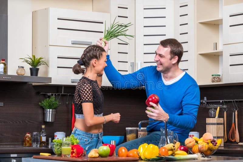 Young Couple Having Fun in the Kitchen Stock Photo - Image of ...