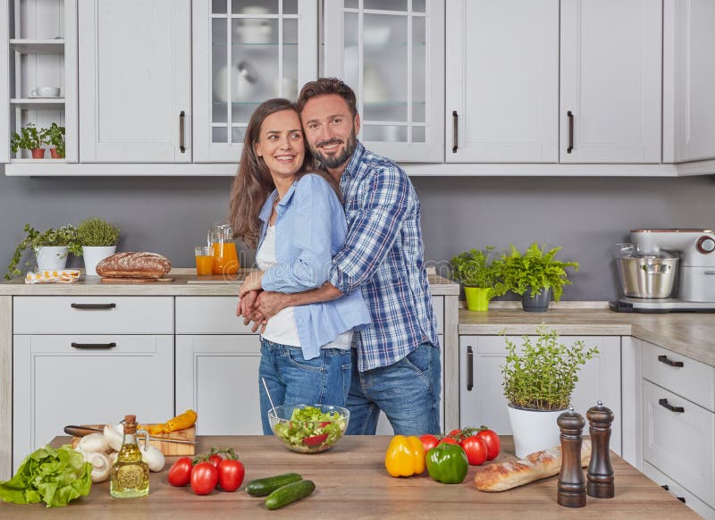 Young Couple in Love in the Kitchen Stock Image - Image of humor ...