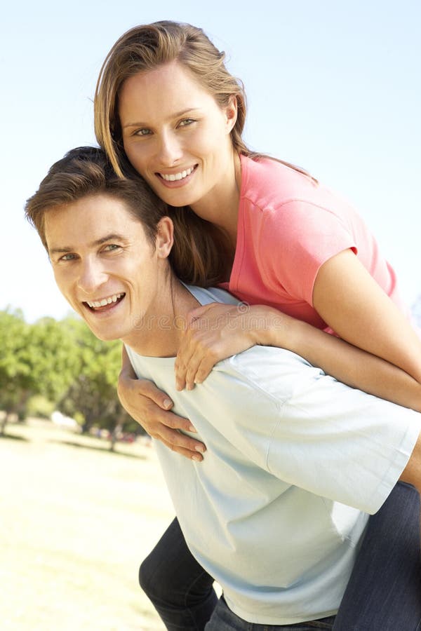 Young Couple Having Fun Piggyback Ride Stock Photo - Image of happy ...