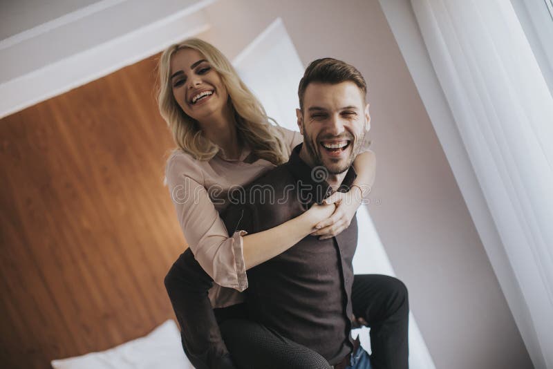 Young Couple Having Fun in the Room Stock Image - Image of back ...