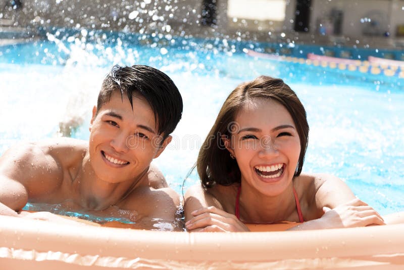Young Couple Having Fun in Swimming Pool Stock Photo - Image of female ...