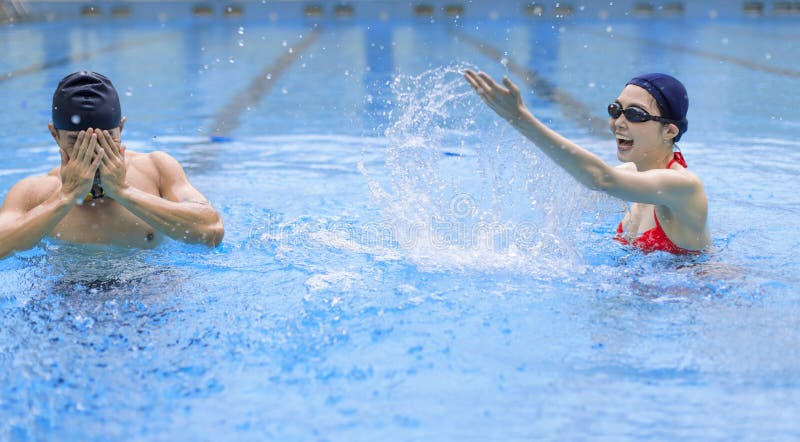 Young Couple Having Fun in Swimming Pool at Summertime Stock Photo ...