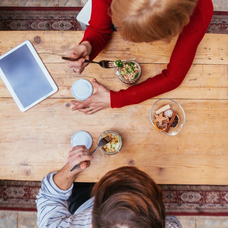 Young Couple Having Lunch stock photo. Image of preserving - 65248574