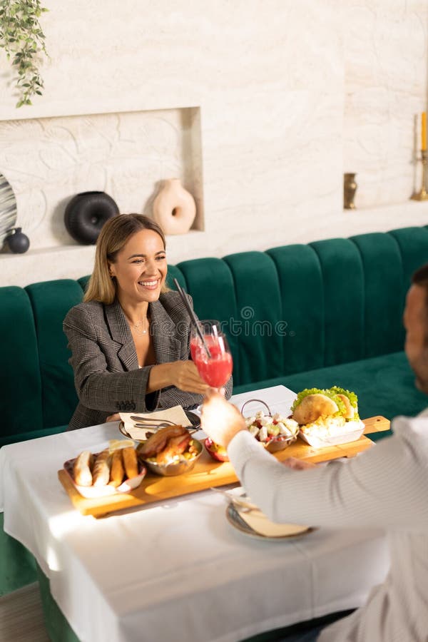 Young Couple Having Lunch and Drinking Fresh Squeezed Juice in the ...