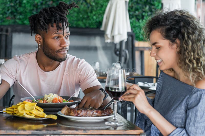 Young Couple Having Lunch Together at a Restaurant. Stock Image - Image ...