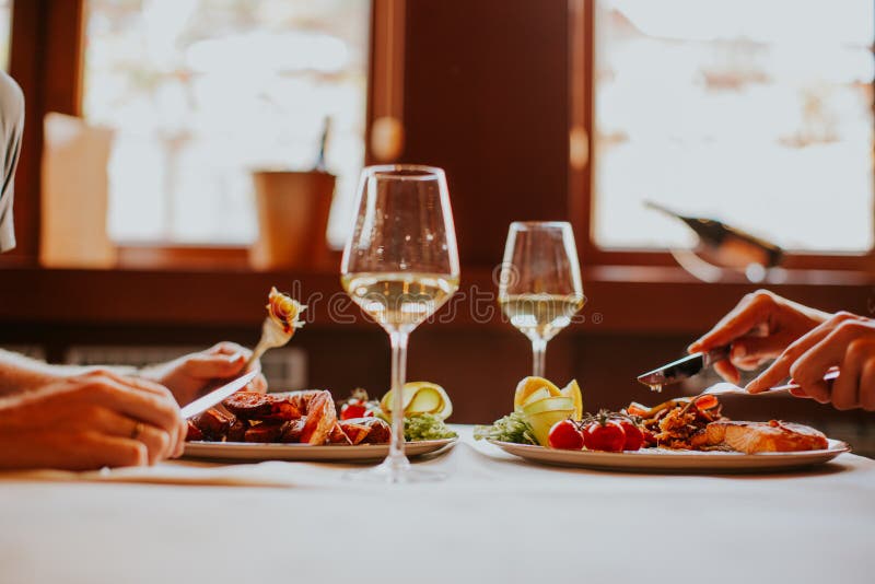Young Couple Having Lunch with White Wine in the Restaurant Stock Photo ...