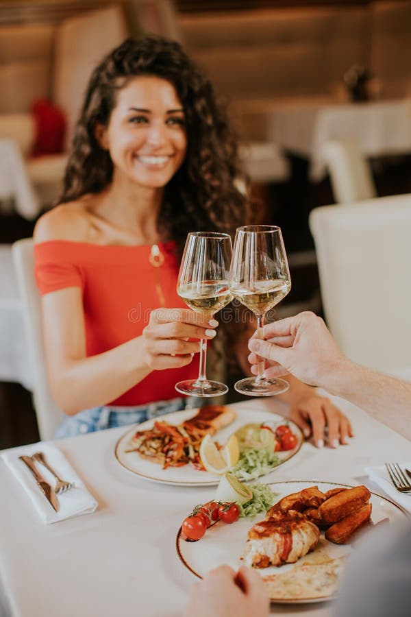 Young Couple Having Lunch with White Wine in the Restaurant Stock Image ...