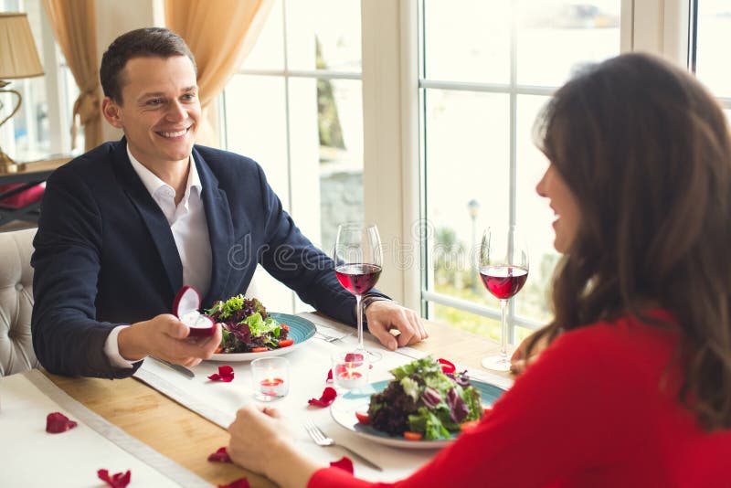 Young Couple Having Romantic Dinner in the Restaurant Proposal Ring ...